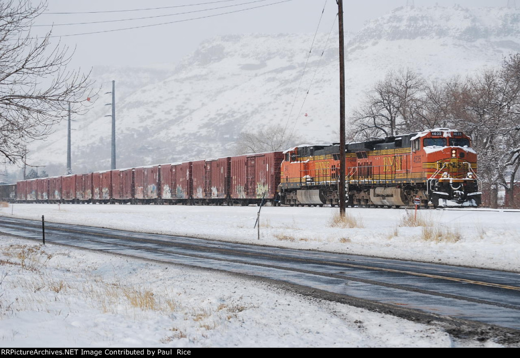 BNSF 4635 Point on The East Bound Beer Train Departing Golden On A Snowy Morning